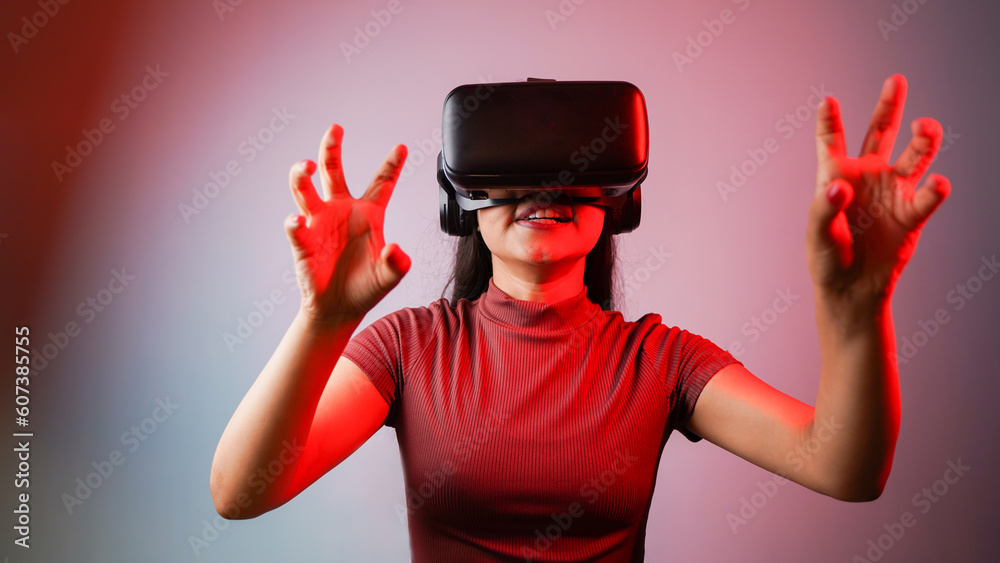 Young Asian Indian woman scared, wearing virtual reality headset, a ...