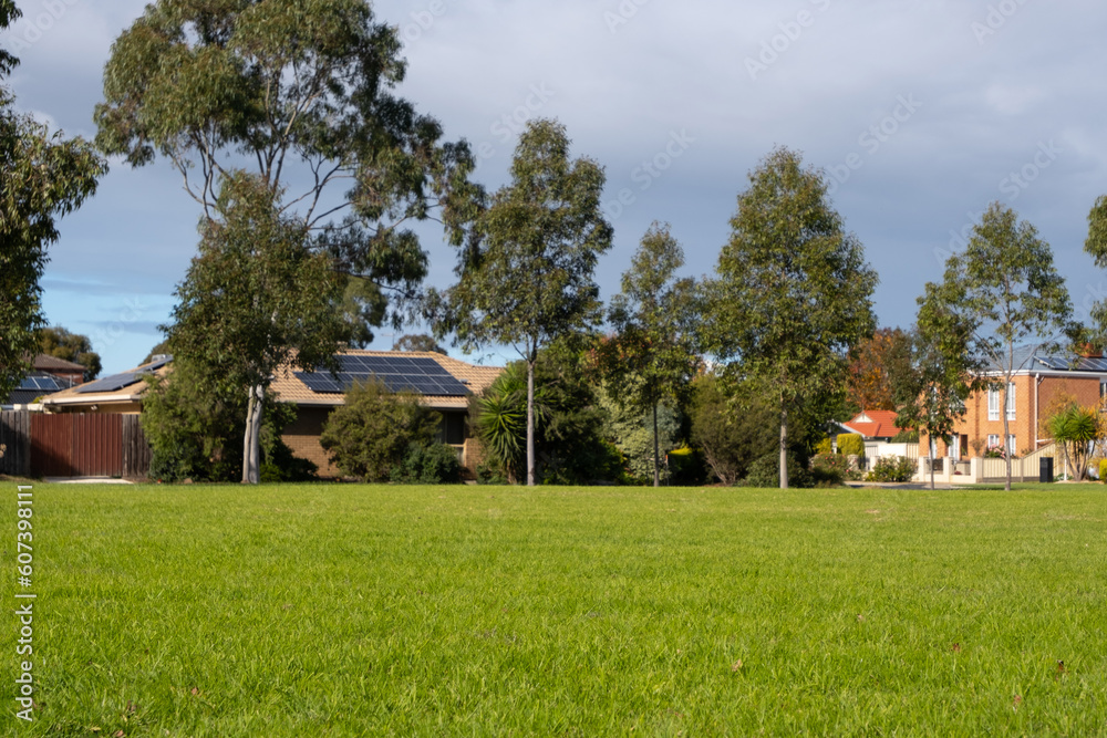 house in the parkVacant green grassy sports ground in a public local ...