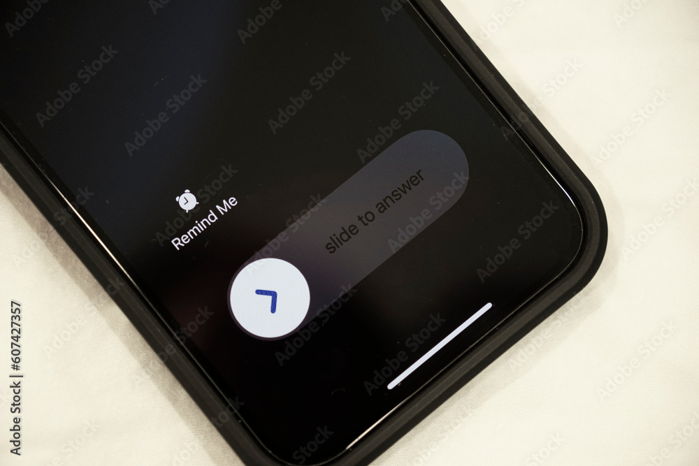 Incoming call slide to answer and remind option on Iphone screen in Ho ...