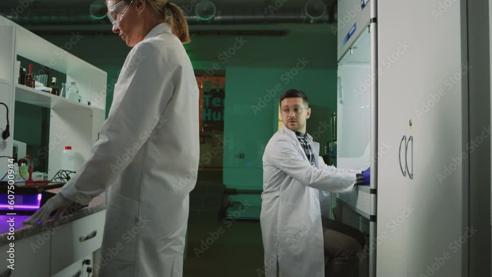 Team of Caucasian scientists working in modern medical research ...