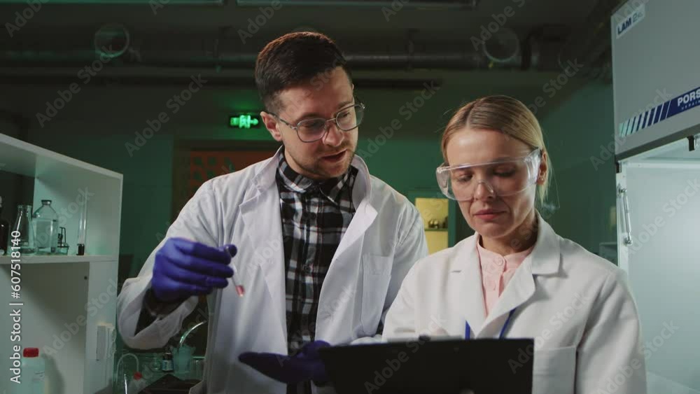 Scientists discussing results of experiment. Doctor and assistant ...