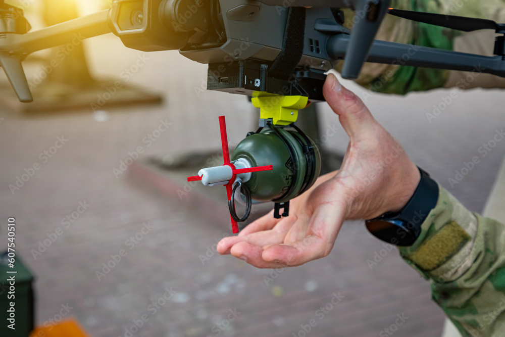 Soldier ties grenade blow up an enemy with military drone. Concept ...