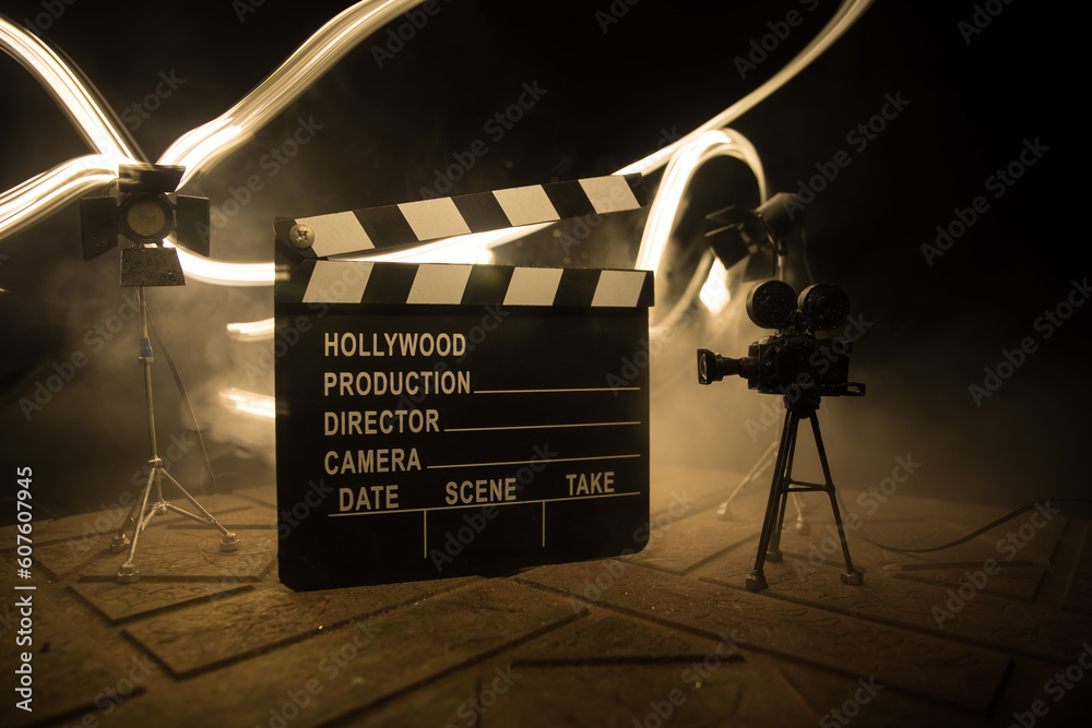 Movie concept. Miniature movie set on dark toned background with fog ...