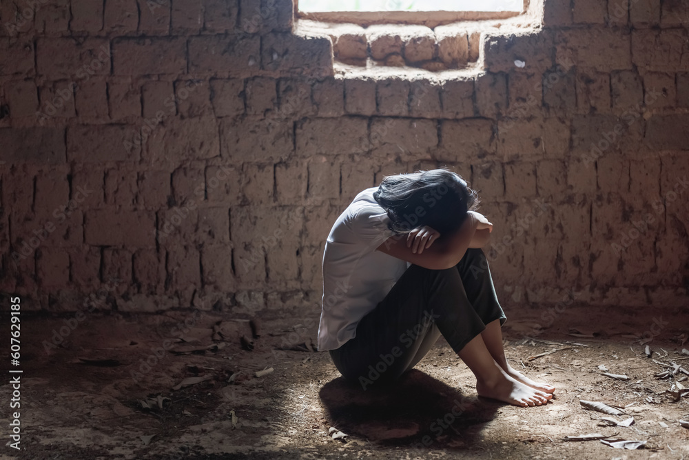 Sad girl sitting in old room. Human trafficking concept, human rights ...