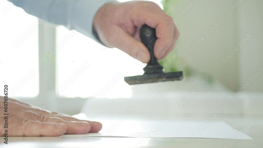 Blurred Shooting with a Businessman Approving a Document Using a Rubber ...