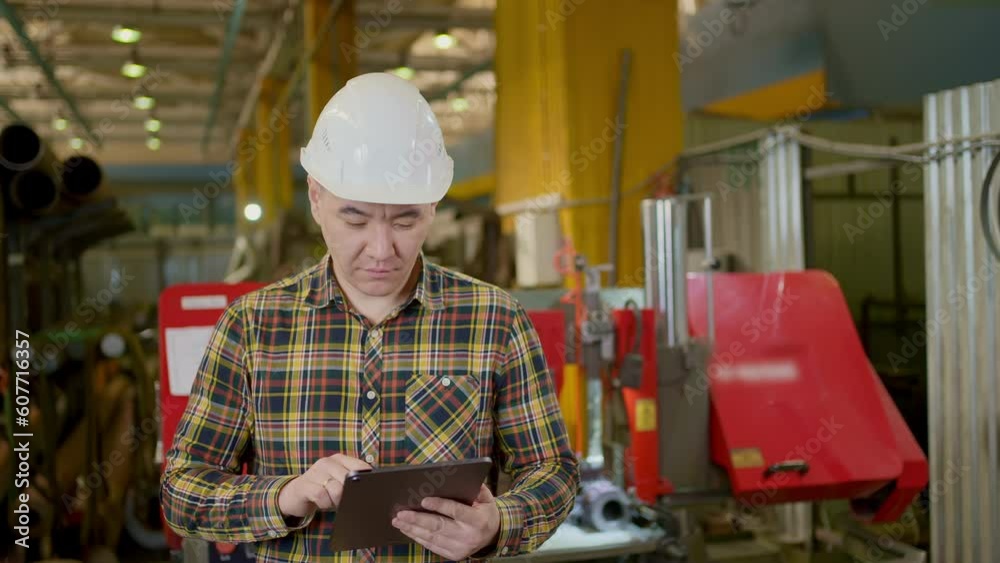 Engineer asian man operator of machine line Heavy industry plant using ...