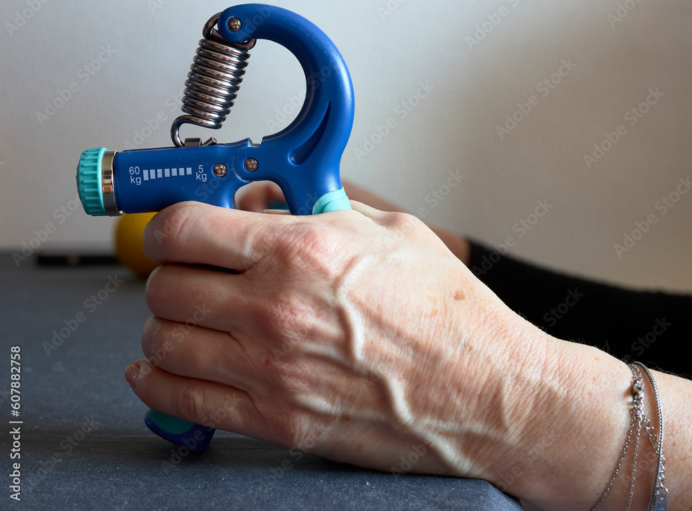 Hand strengthening grips. With adjustable resistance springs for ...