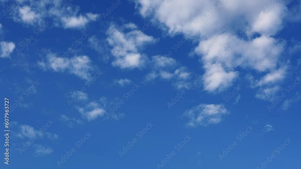 Blue soft clear sky, white rolling, fast motion wind fast moving clouds ...