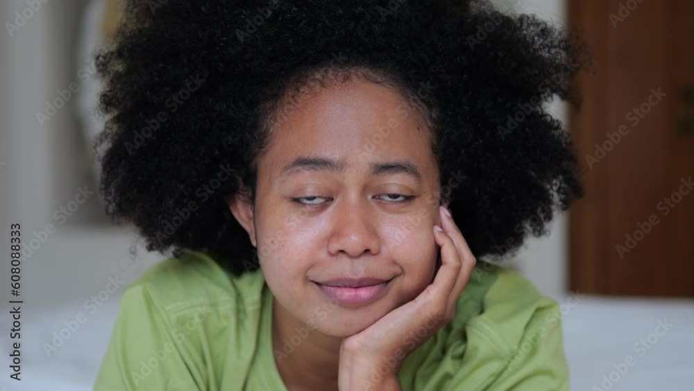 Close-up of multiracial multinational woman looking into camera with ...