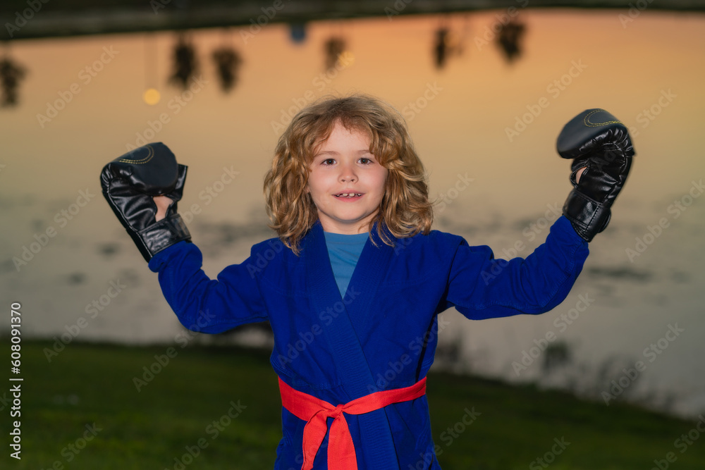 Little karate fighter. Kid boy practicing karate outdoor. Sport karate ...