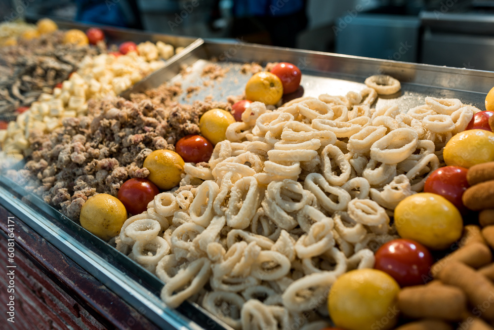 traditional spanish squid rings and fried calamari display in a ...