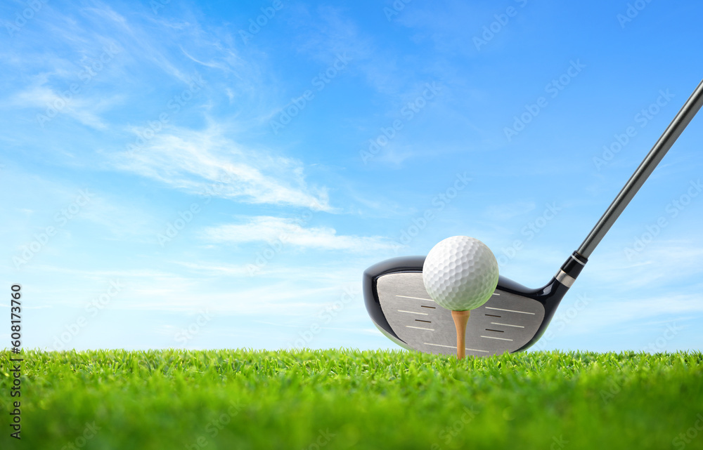 Golf ball on tee and driver golf club with blue sky background. Stock ...