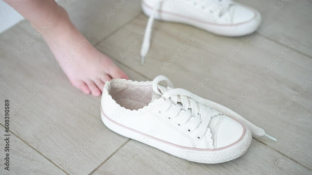Girl hands puts on shoes, get ready for school or walk outdoors Stock ...