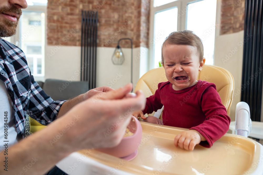 Toddler cute baby girl crying and don't want to eat food from her ...