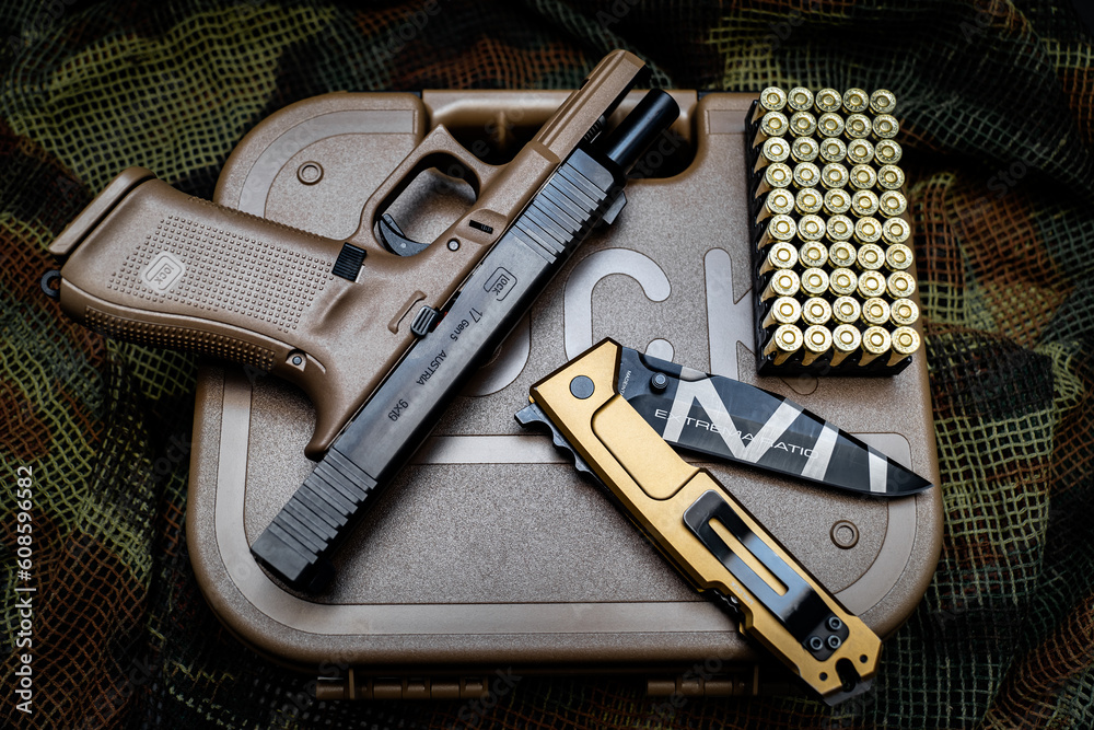 Baltic States, May 2023. Austrian Glock 17 pistol with brown frame ...