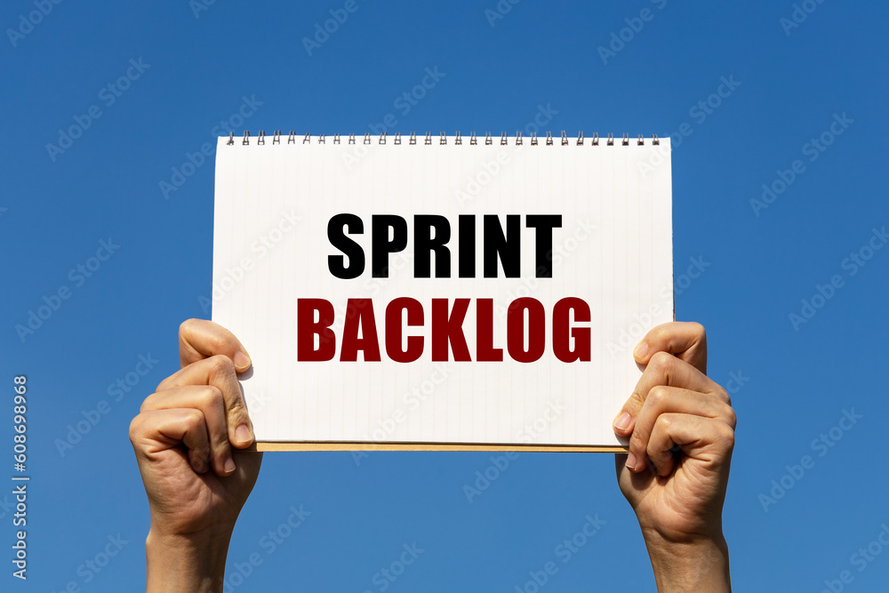 Sprint backlog text on notebook paper held by 2 hands with isolated ...