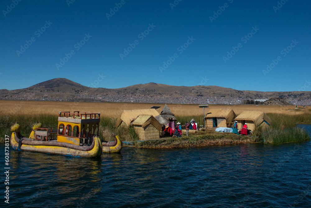 Floating island of Uros, with views of Lake Titicaca and a typical Uros ...