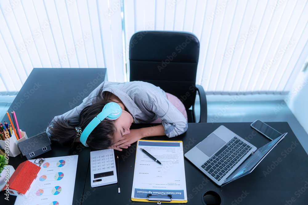 Exhausted and tired young adult office worker falling asleep on desk ...