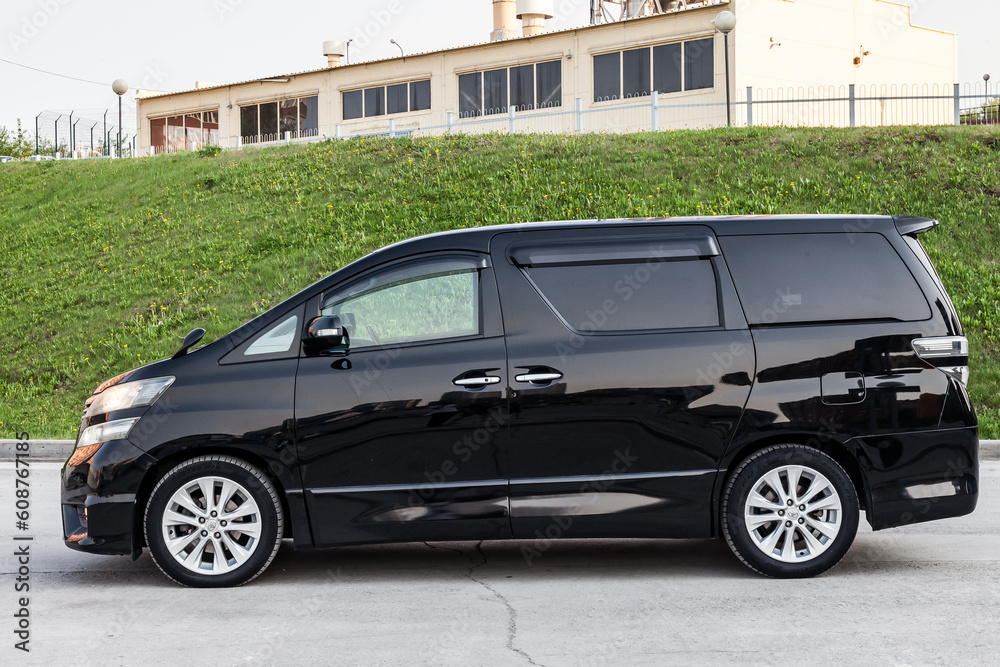 Side View of Toyota Vellfire japanese luxury minivan car in black color ...