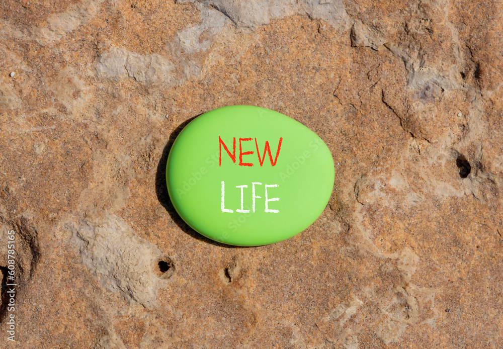 New life symbol. Concept words New life on beautiful green stone on a ...