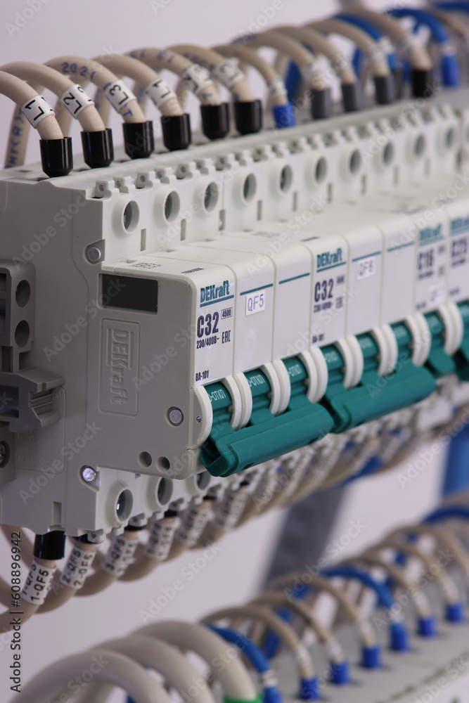 DEKraft electric circuit breakers installed on a din rail in an ...