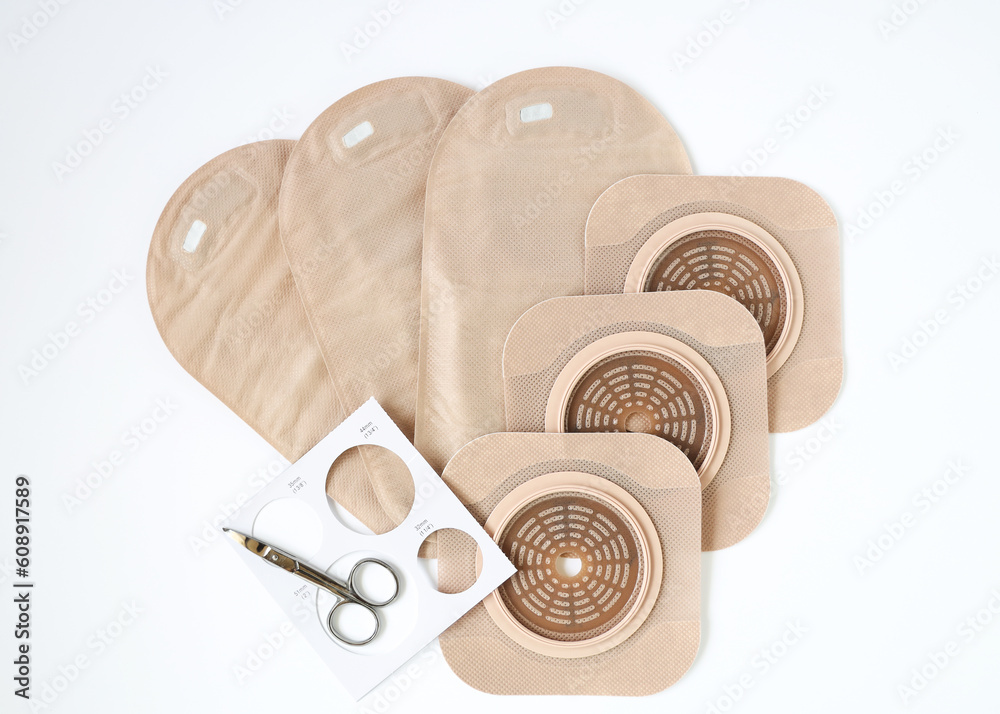 Two piece ostomy appliance including flange, pouch, measuring guide and ...