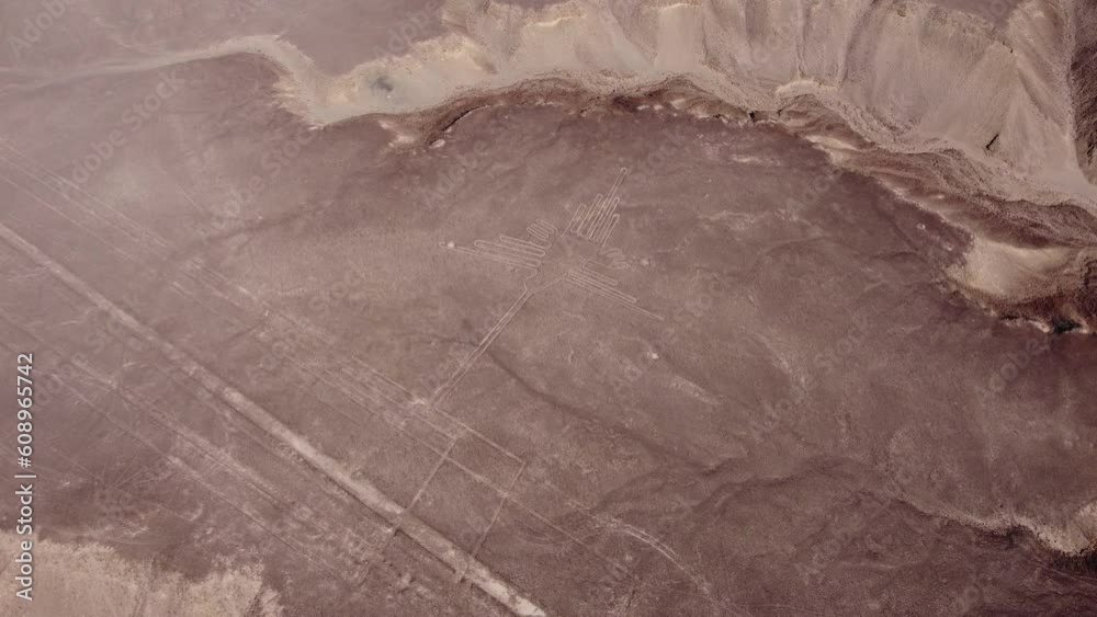 Ancient geoglyph of a hummingbird part of the famous Nazca Lines. Drone ...