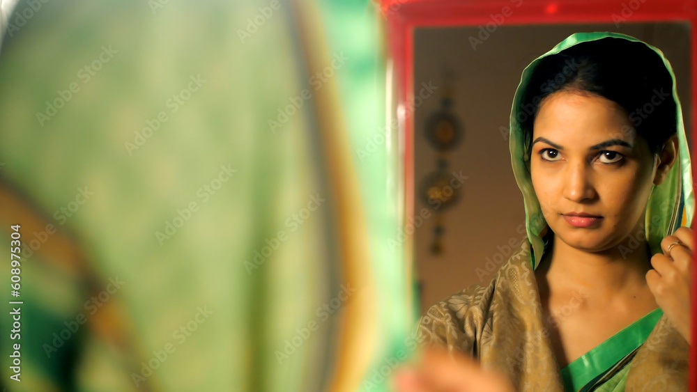 A happy female farmer / traditional villager adjusting her Pallu before ...
