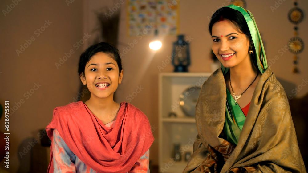 An attractive housewife and her little school-aged daughter talking on ...