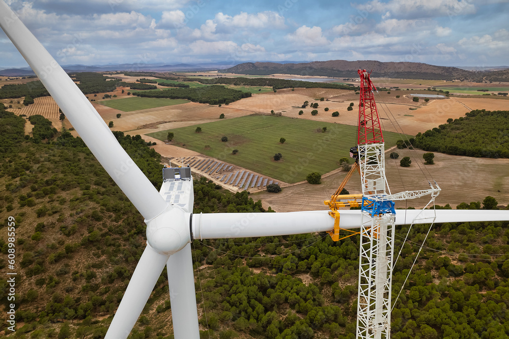 Top view of the installation of the blades on a windmill at a wind farm ...