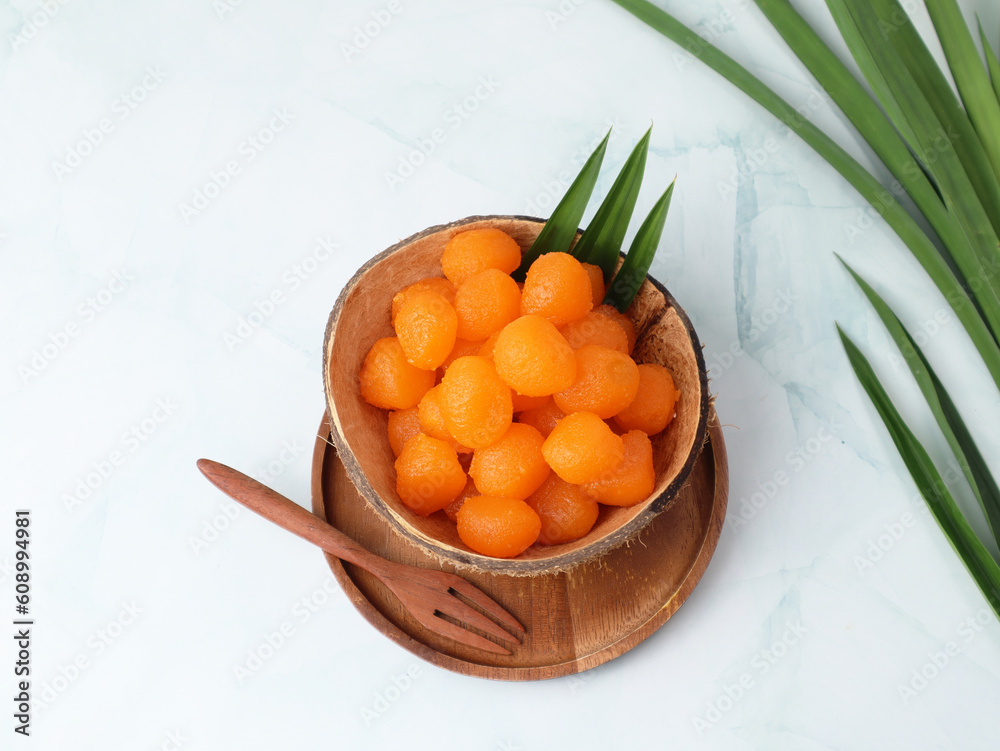 Golden drop egg, an ancient Thai dessert in coconut shell (Khanom Thong ...