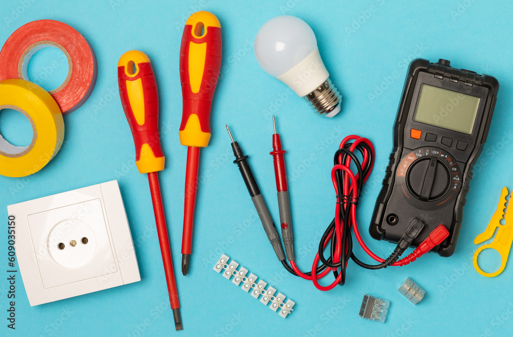 Electrician equipment on blue background with copy space.Top view ...