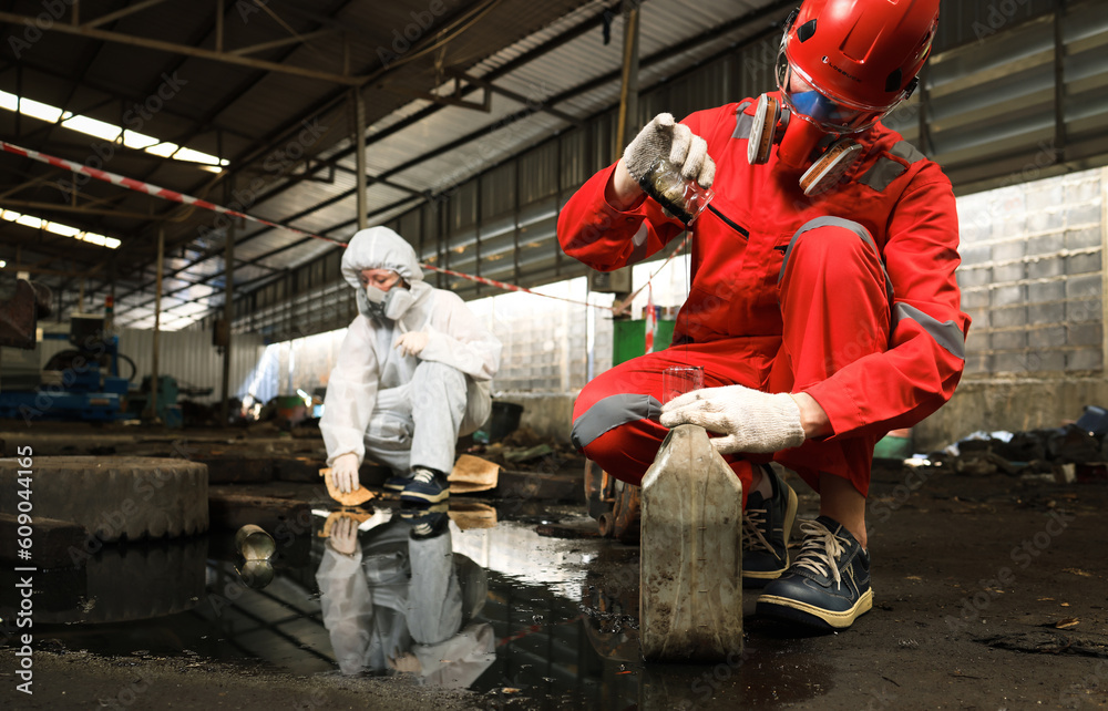 scientist and safety officer wearing safety protection with gas masks ...