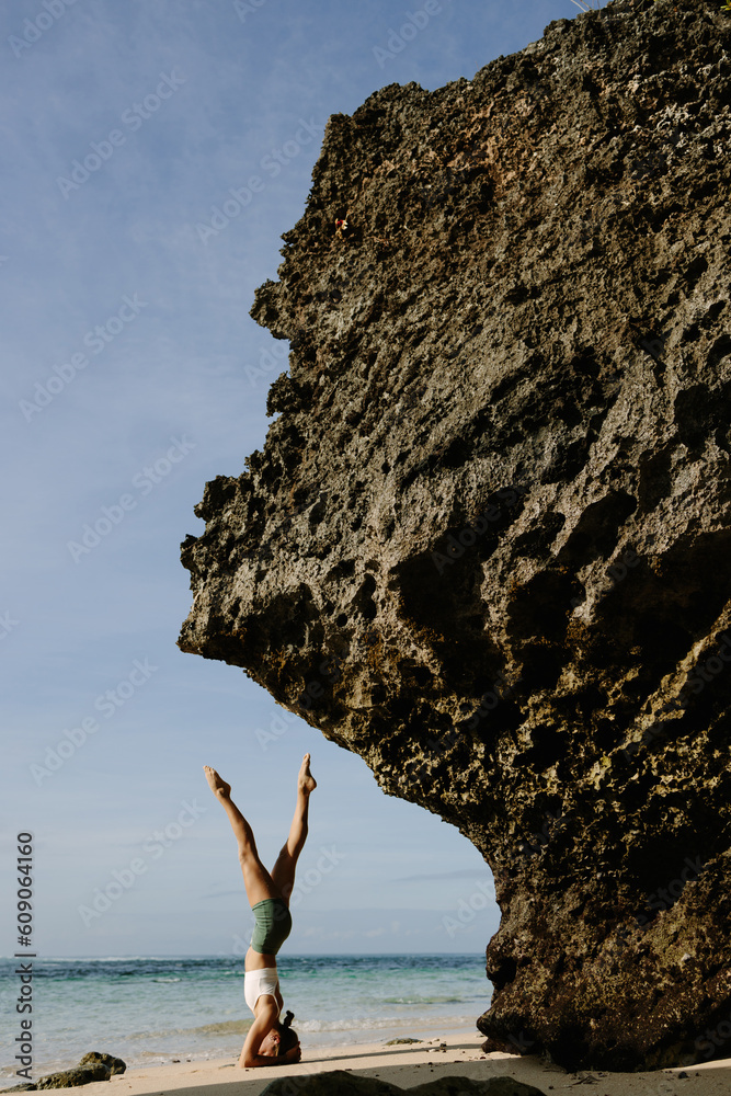 Young good shape woman performing art gymnastics element, making ...
