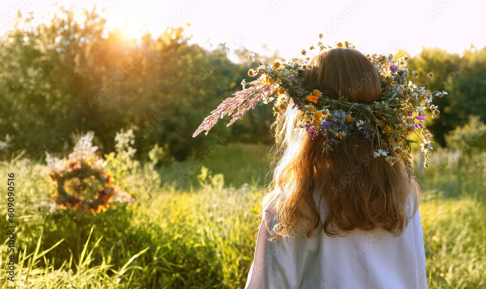 Girl in flower wreath on sunny meadow, natural abstract background ...