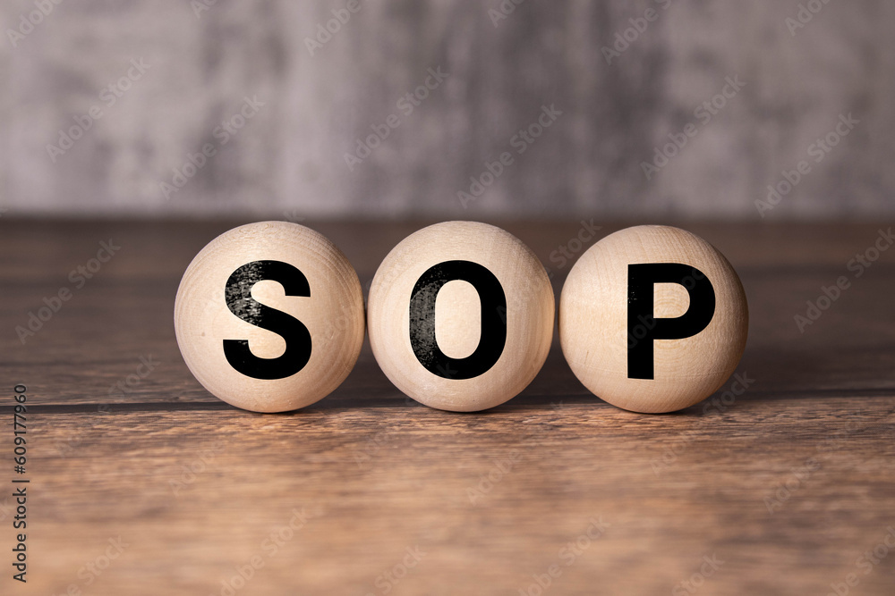 SOP - acronym from wooden blocks with letters, abbreviation SOP ...