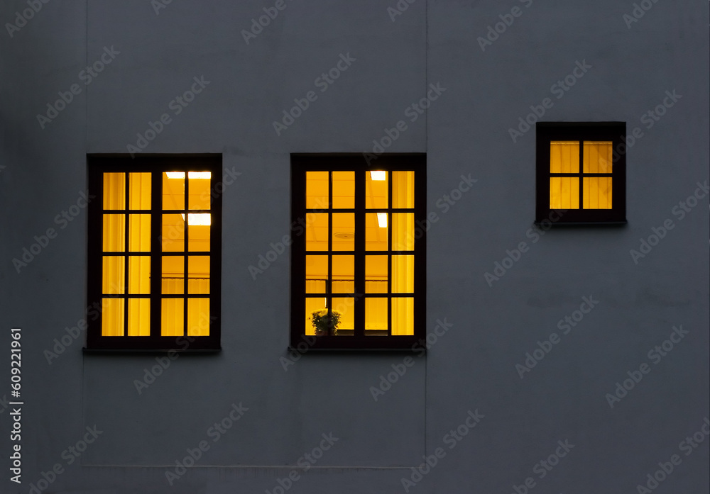 Look through a windows from outside to inside. Lightened two large and ...