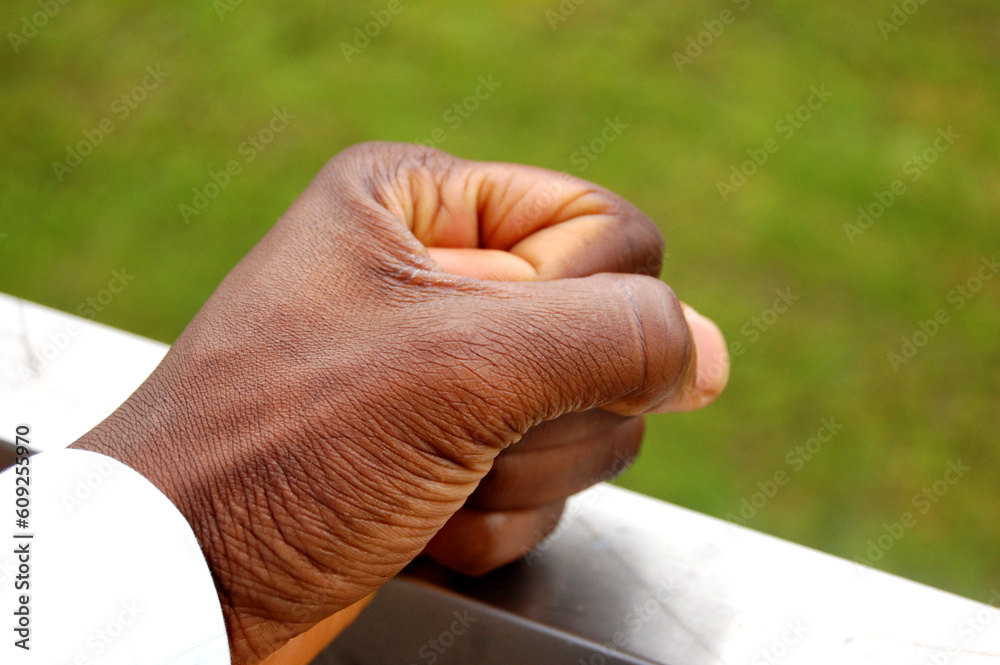 Foto de This is an image of a fist "stamped" against a metal surface ...