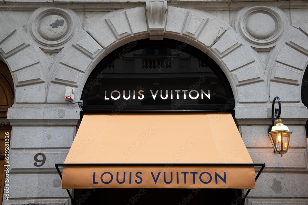 louis vuitton logo brand and sign text front wall facade entrance up ...
