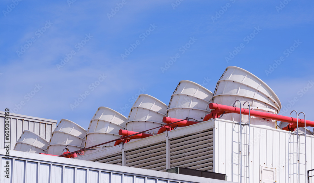 Row of white ventilation chimneys with pipelines and exhausting machine ...