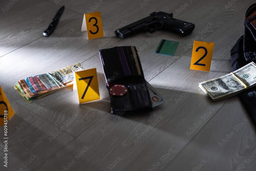 Crime scene investigation concept - Pistol and bullet shell against the ...