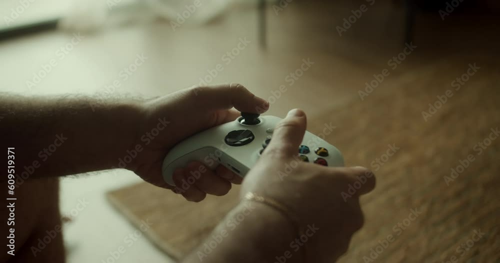 Man gamer hands holding modern console for play station close-up, guy ...