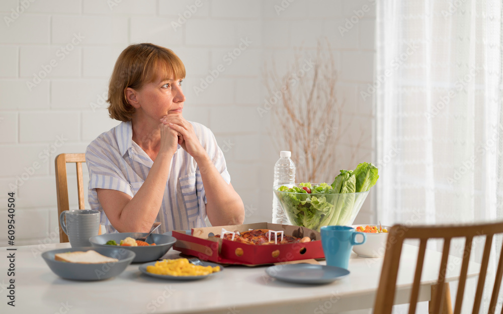 Elderly retired grandmother stay at home with painful face sitting ...