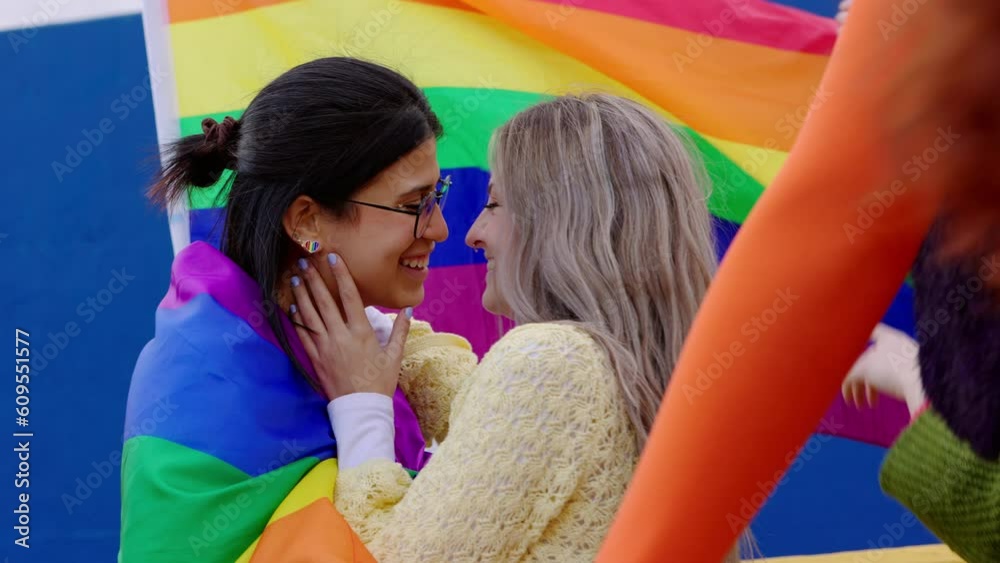 Vidéo Stock Lesbian couple kissing on LGBTQ parade festival. Two young ...