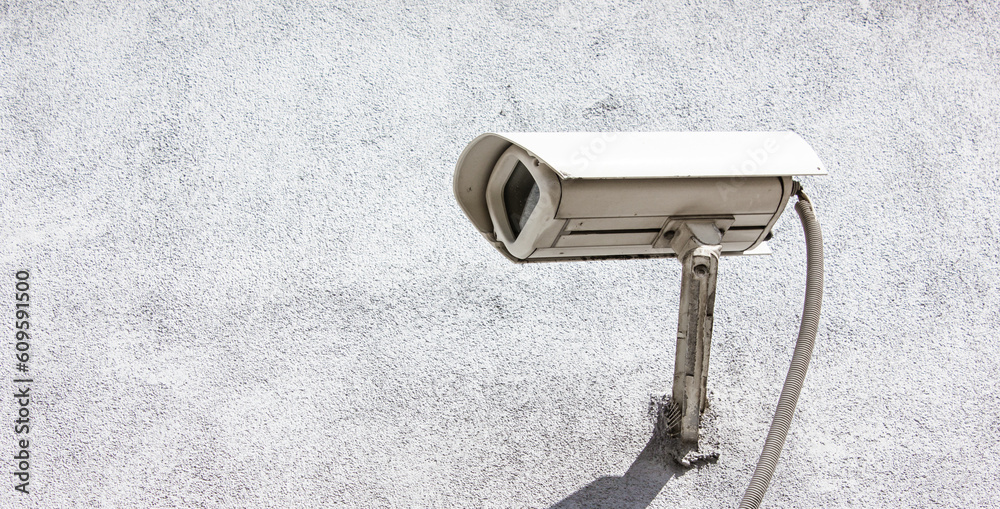 CCTV camera on a concrete wall. Protection of the object with the help ...