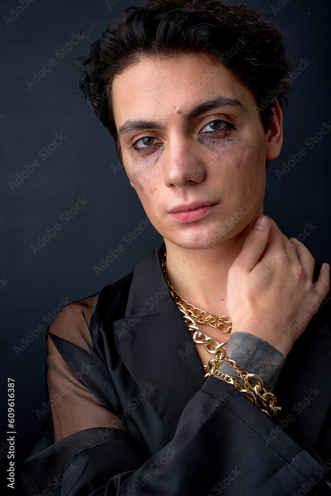 young caucasian upset elegant gay posing with mascara smudged from ...