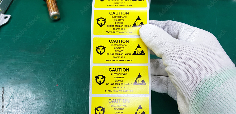 Hand holding ESD symbol label with antistatic gloves,Electrostatic ...