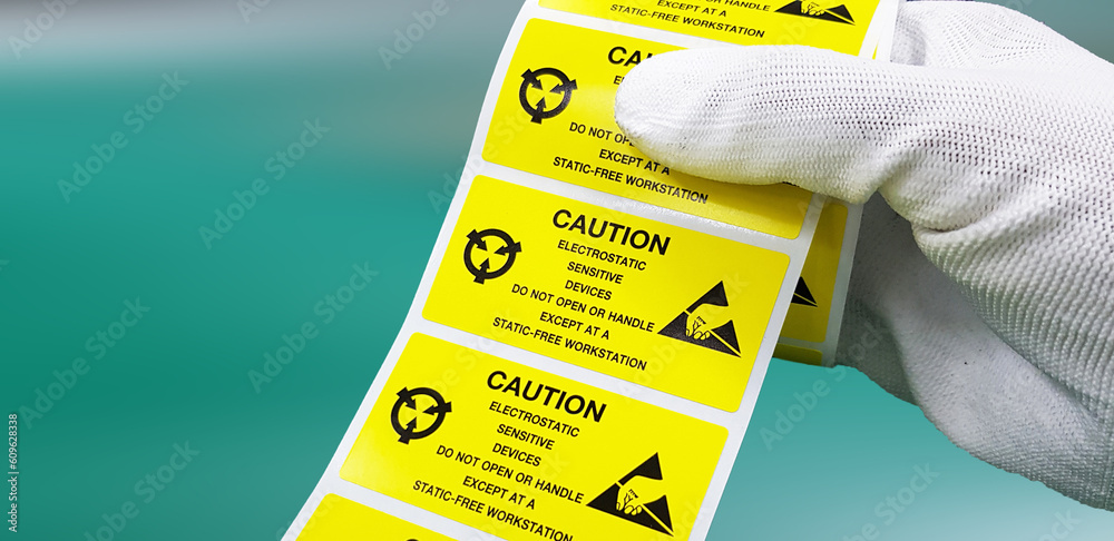 Hand holding ESD symbol label with antistatic gloves,Electrostatic ...
