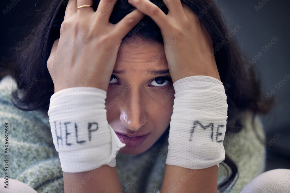 Depression, wrist and woman with help on bandage for suicide, self harm or person in dark mental ...