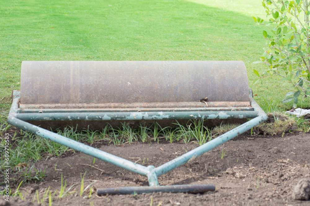 Lawn manual iron lawn roller. Flattening A Gardens Grass Surface Stock ...